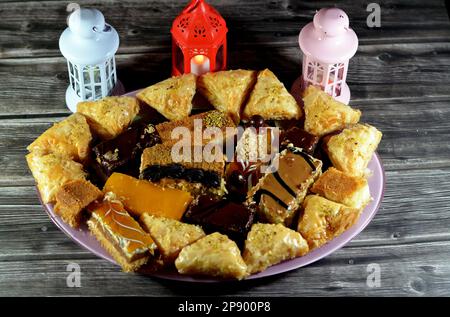 Eastern desserts with Ramadan lanterns, Konafa covered with mango ...