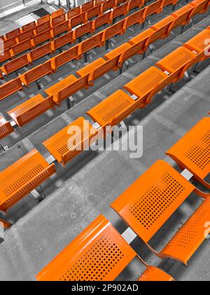 View of orange seats in stadium Stock Photo - Alamy