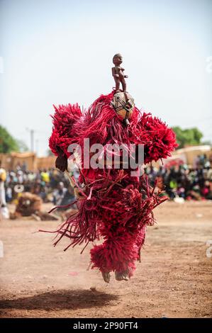 Masked figure performing at Festima Festival in Dedougou, Burkina Faso ...