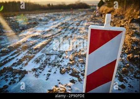 Frozen ruts on a renovated section of city roads Stock Photo - Alamy