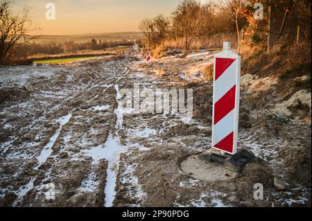 Frozen ruts on a renovated section of city roads Stock Photo - Alamy