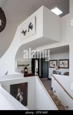 Dramatic double height staircase in newly built Cotswolds home Stock ...
