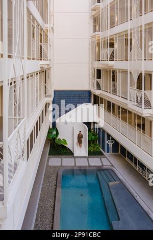 swimming pool at an art deco luxury hotel architecture from the 80s ...