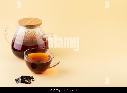 selective focus, freshly brewed tea in a transparent teapot, with ...