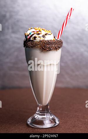 Cocktail for kids - milkshake drink with multicolored chewing marmalade ...