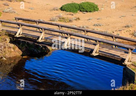 A bridge in the arid, sahara desert and mountainous area of western ...