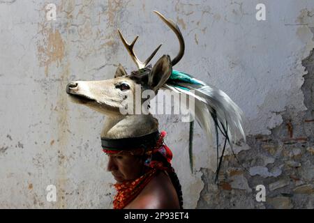 An Aztec dancer poses for a photo during a ceremony celebrating the ...