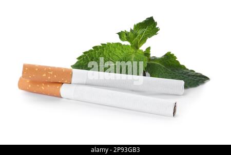 Menthol cigarettes and fresh mint leaves on white background Stock ...