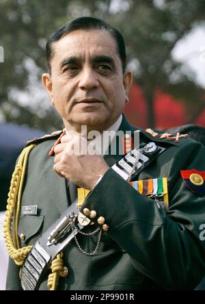 Indian Army Chief Gen. Deepak Kapoor, right, presents a bar signifying ...