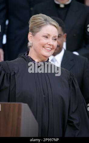 Chief Justice Catherine D. "Kitty" Kimball hugs her grandchildren at ...