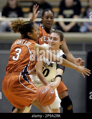 Purdue guard Jodi Howell, left, shoots under Wisconsin forward Anya ...