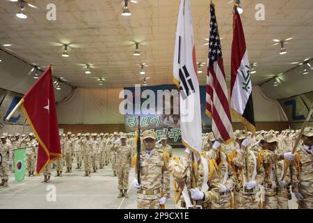 South Korean soldiers carry flags during a ceremony to mark the end of ...