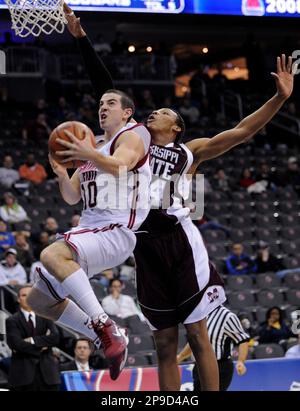 Washington State guard Taylor Rochestie hugs forward Robbie Cowgill (34 ...