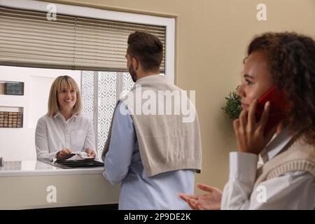 Man receiving money at cash department window in bank. Currency ...
