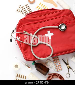 Flat lay composition with first aid kit on blue background, space for ...