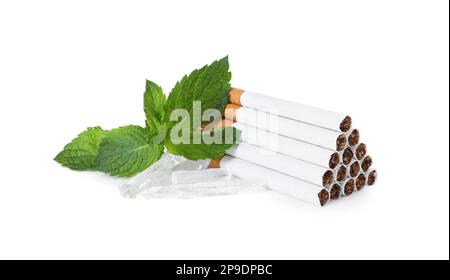 Cigarettes, menthol crystals and mint on black background, flat lay ...