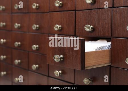 Open wooden drawer with index cards of library catalog Stock Photo - Alamy