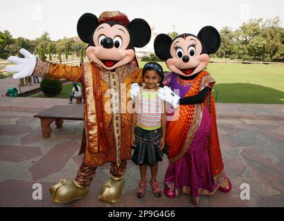 Mickey Mouse and Minnie Mouse pose at the Taj Mahal in Agra, India. The ...