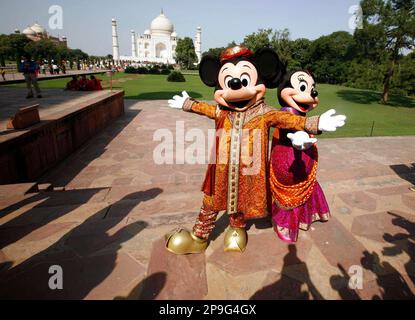 Mickey Mouse and Minnie Mouse pose at the Taj Mahal in Agra, India. The ...