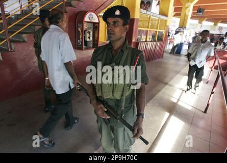 A Sri Lankan army soldier stands guard during the funeral ceremony of ...