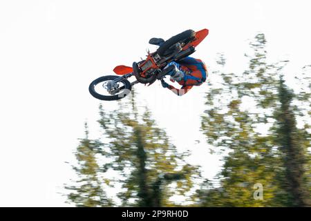 Motocross MX Freestyle jump at tree tops level Stock Photo - Alamy
