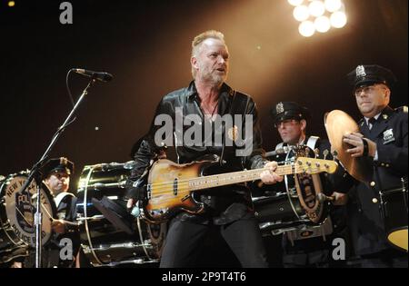 Lead vocalist and bassist Sting, center, and his band The Police are ...