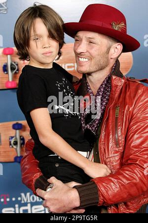 Singer Scott Weiland, right, and his son Noah Weiland pose on the press ...