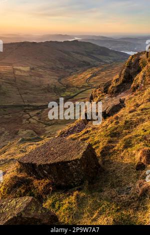 Aerial view of misty Lake Windermere at sunset with majestic mountains ...