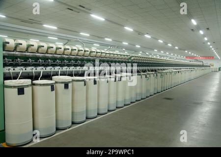 Cotton group in spinning production line factory Stock Photo - Alamy