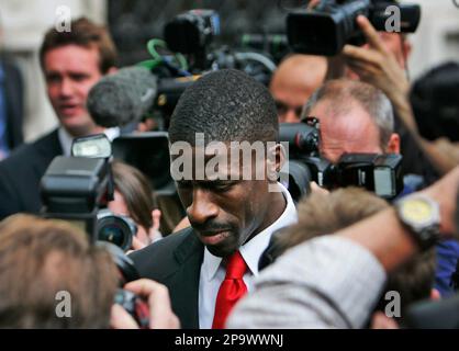 Dwain Chambers leaves the High Court in London, after he lost his ...