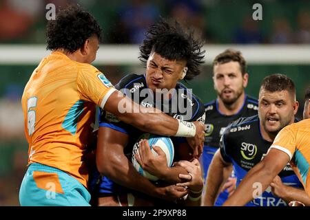 Miracle Faiilagi of Moana Pasifika is tackled by Bayley Kuenzle and Tom ...