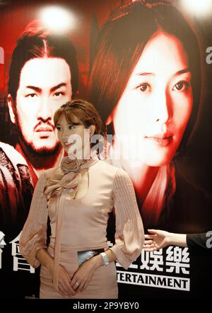 Taiwanese actress Lin Chi-ling poses with her trophies at the 23rd ...