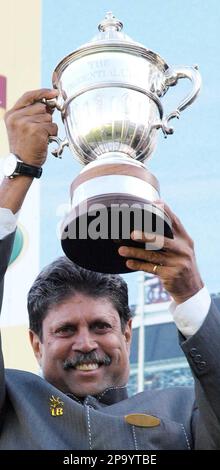 India captain Kapil Dev holds the Prudential World Cup aloft for the ...