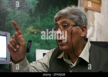 Former Abu Ghraib detainee Ali Shallal al-Qaisi points to his photo ...