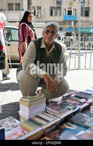 Former Abu Ghraib detainee Ali Shallal al-Qaisi points to his photo ...