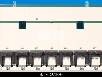 Truck loading bays at a large distribution warehouse Stock Photo - Alamy