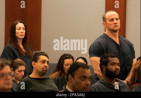 Professional bodybuilder Kelly Ryan, right, reads a statement to the ...