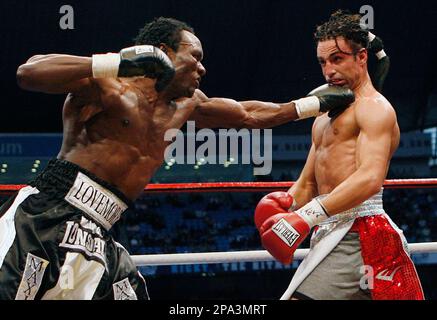 American boxer Paul Malignaggi, right, takes a punch from Lovemore N ...