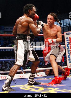 American boxer Paul Malignaggi, right, takes a punch from Lovemore N ...