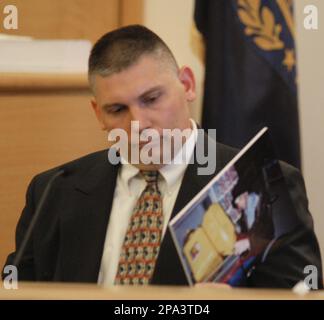 Epping, N.H. Police Sgt. Sean Gallagher , right, points to a mock-up of ...