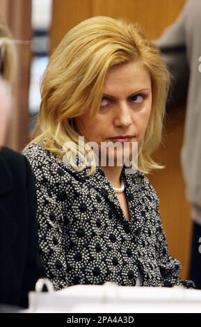 Dina Matos McGreevey looks across the court room as she listens to ...