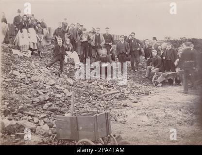 Families picking coal from a colliery soil heap. The early 20th century ...