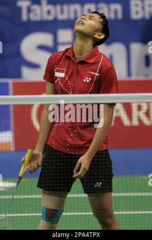 Indonesia's Maria Kristin reacts after defeating Hong Kong's Pui Yin ...