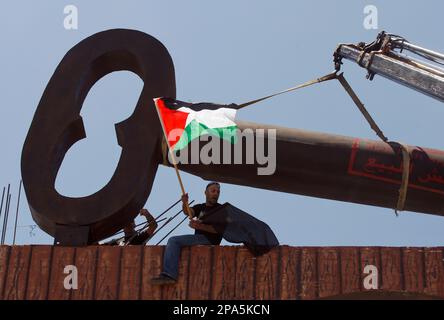 A key, symbol of the palestinian right of return, at the entrance of ...