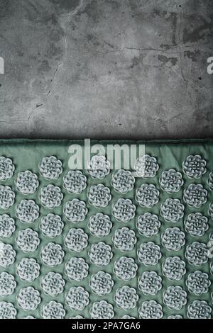 Massage mat with prickly spikes Kuznetsov applicator top view. On a ...