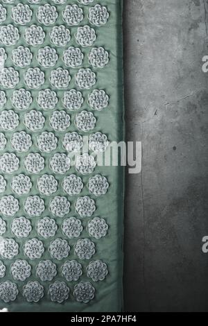 Massage mat with prickly spikes Kuznetsov applicator top view. On a ...