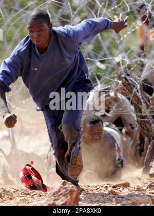 A Zimbabwean man flees across border at Beitbridge Border Post in ...