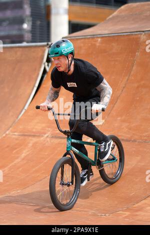 Members of Team Extreme performing BMX Bike tricks on the half pipe at ...