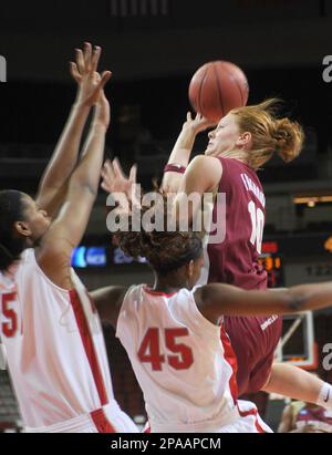 Ohio State's Tamarah Riley, left, drives to the basket against Montana ...