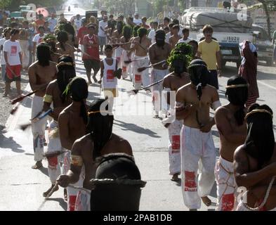 Male devotees flagellate themselves to atone for their sins as they ...